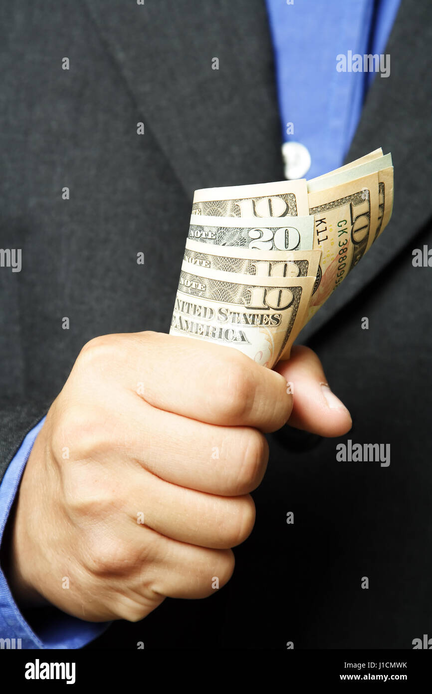 Man holding roll dollar bills hi-res stock photography and images - Alamy
