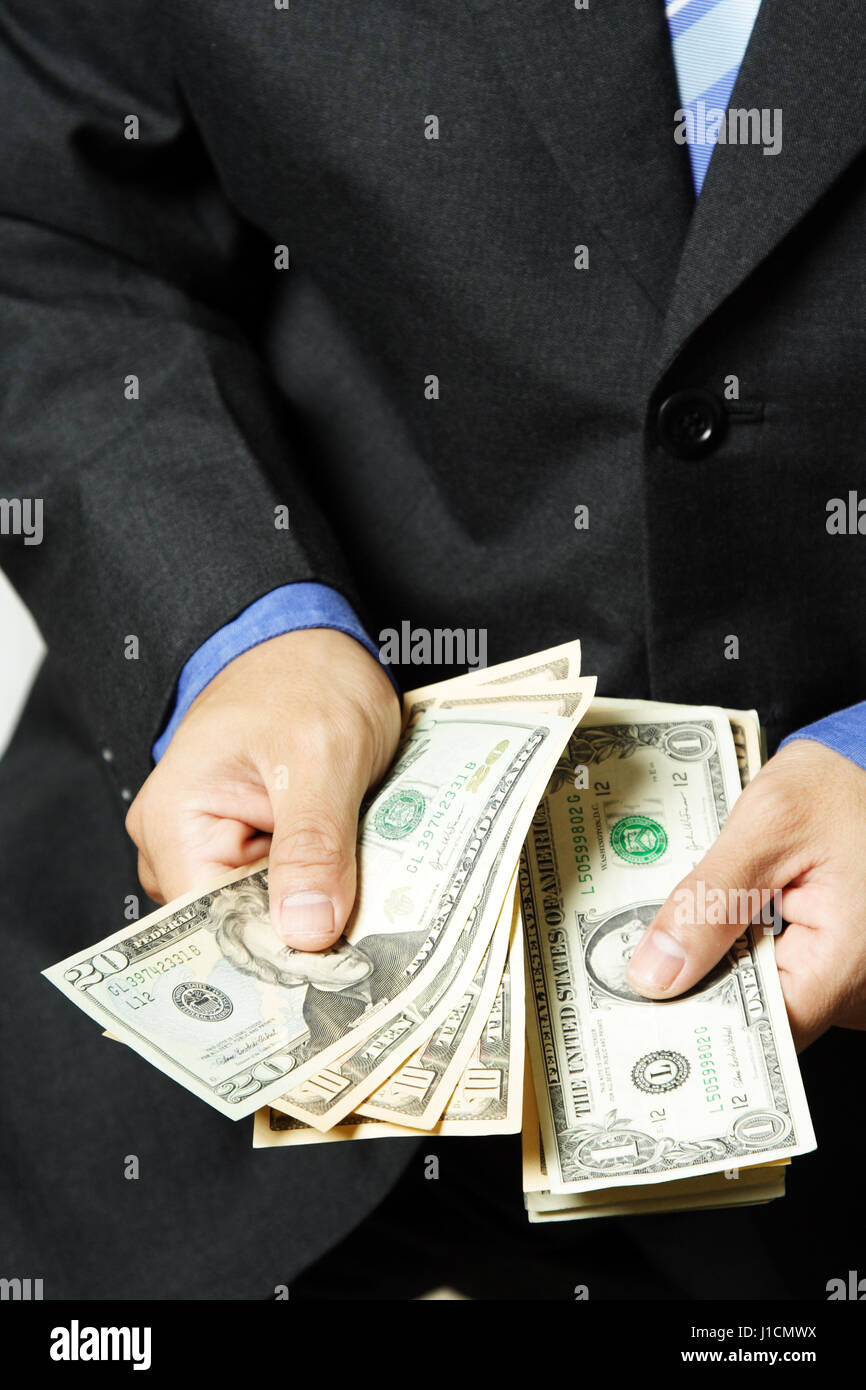 A shot of a businessman counting his money Stock Photo - Alamy