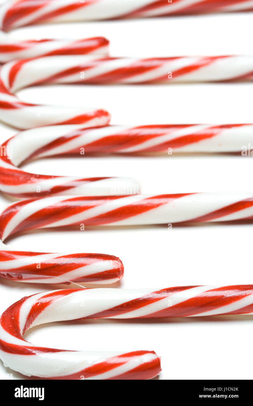 A shot of christmas candy cane in a row Stock Photo - Alamy