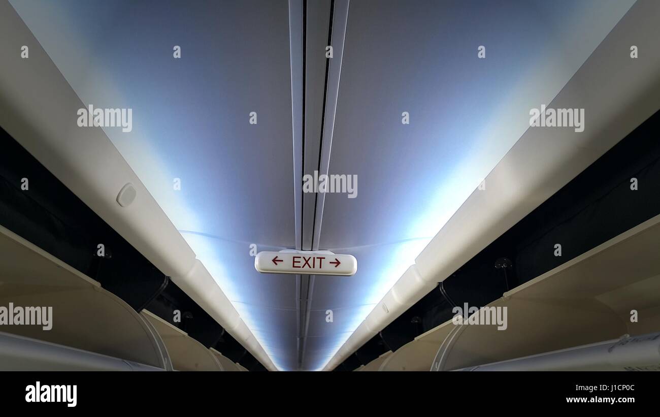 Airplane cabin interior exit sign hi-res stock photography and images ...