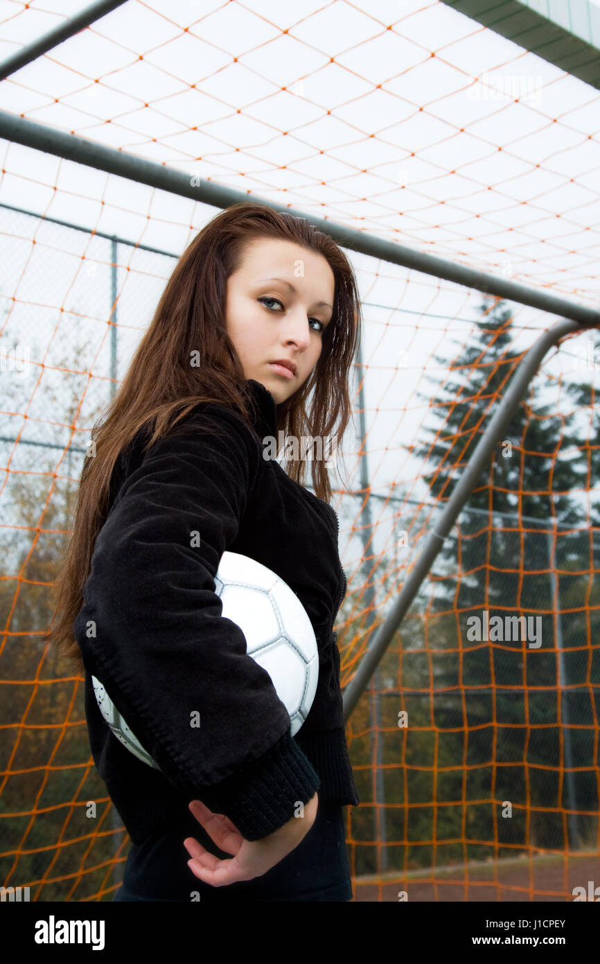 A beautiful soccer player posing with a soccer ball Stock Photo - Alamy