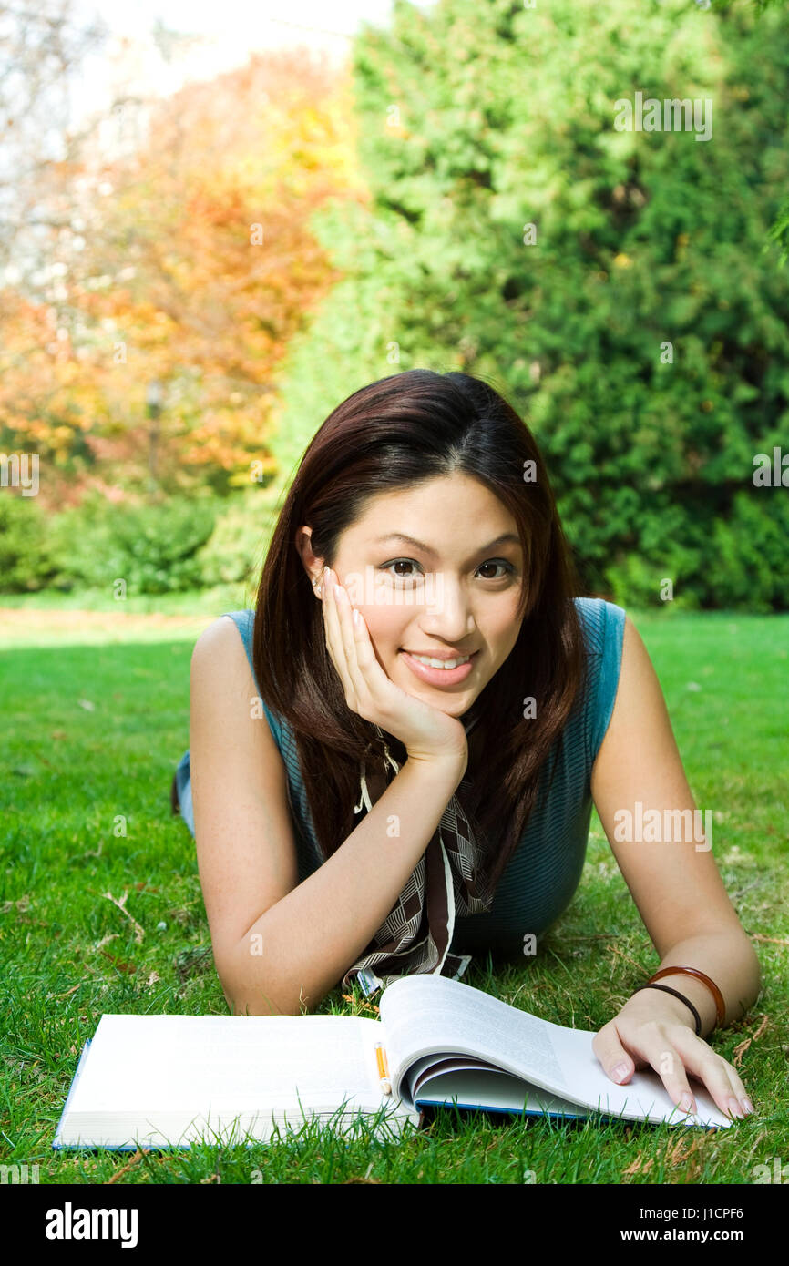 A beautiful young college student studying on campus Stock Photo - Alamy