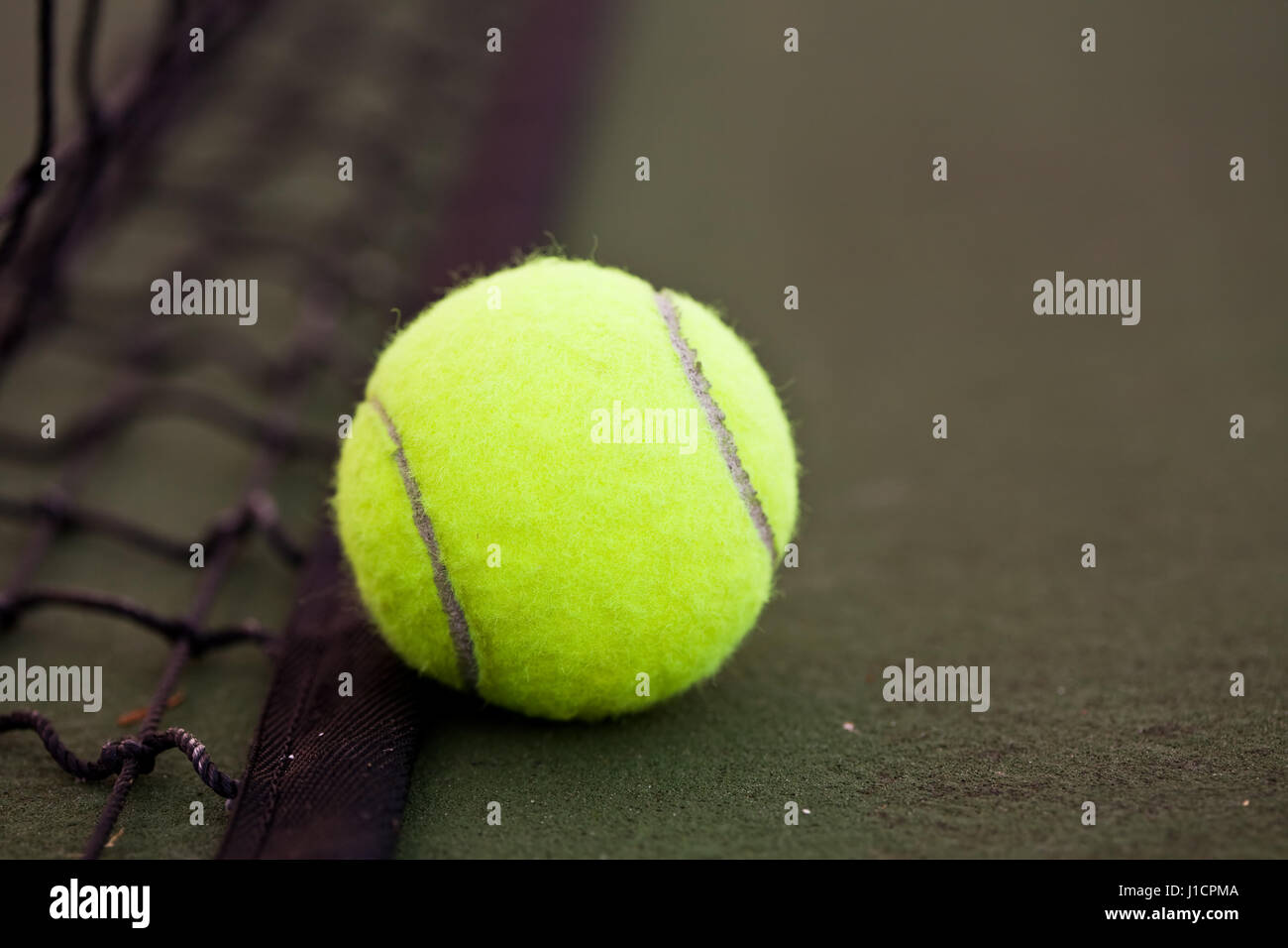 A shot of a tennis ball and a net on a tennis court Stock Photo - Alamy