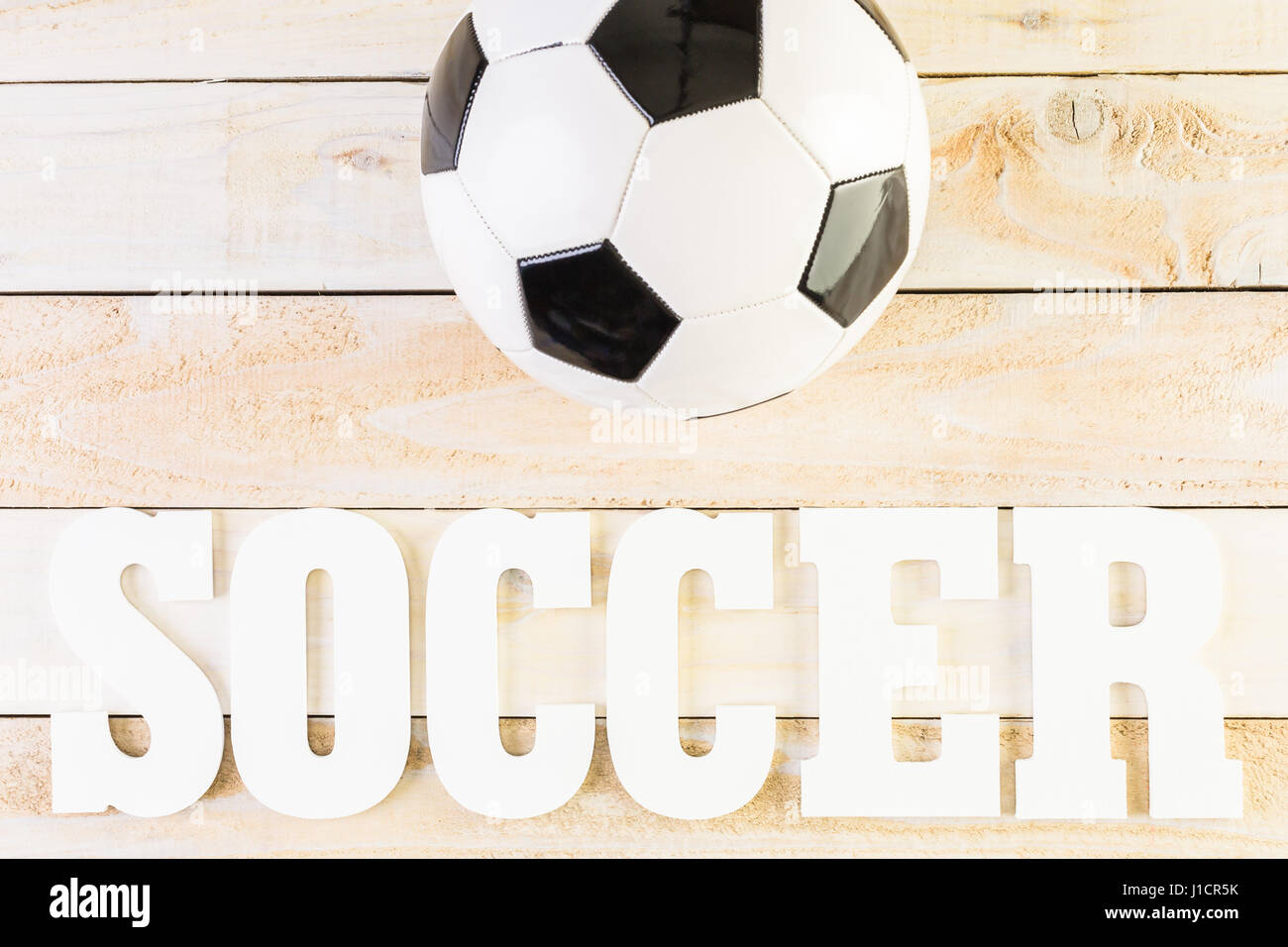White letters Soccer on a wood background Stock Photo - Alamy