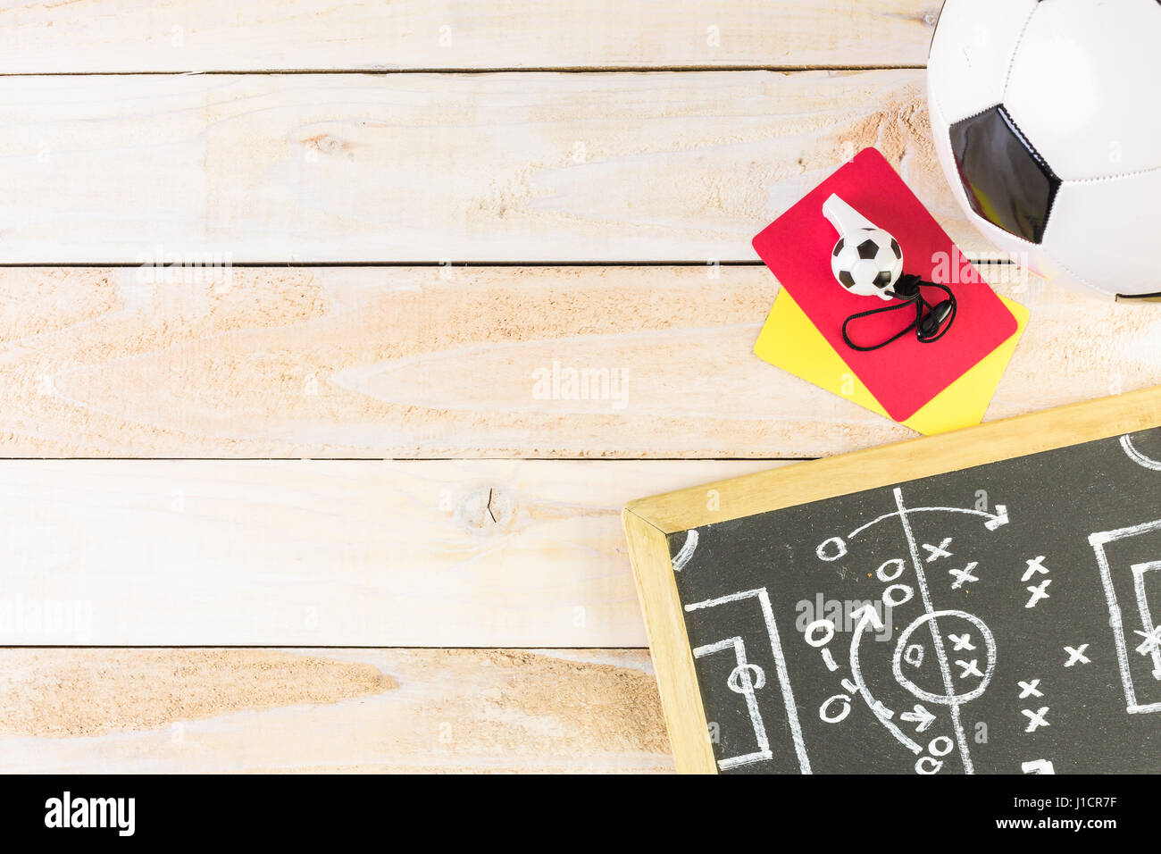 Chalk game plan board and soccer ball on a wood table Stock Photo - Alamy