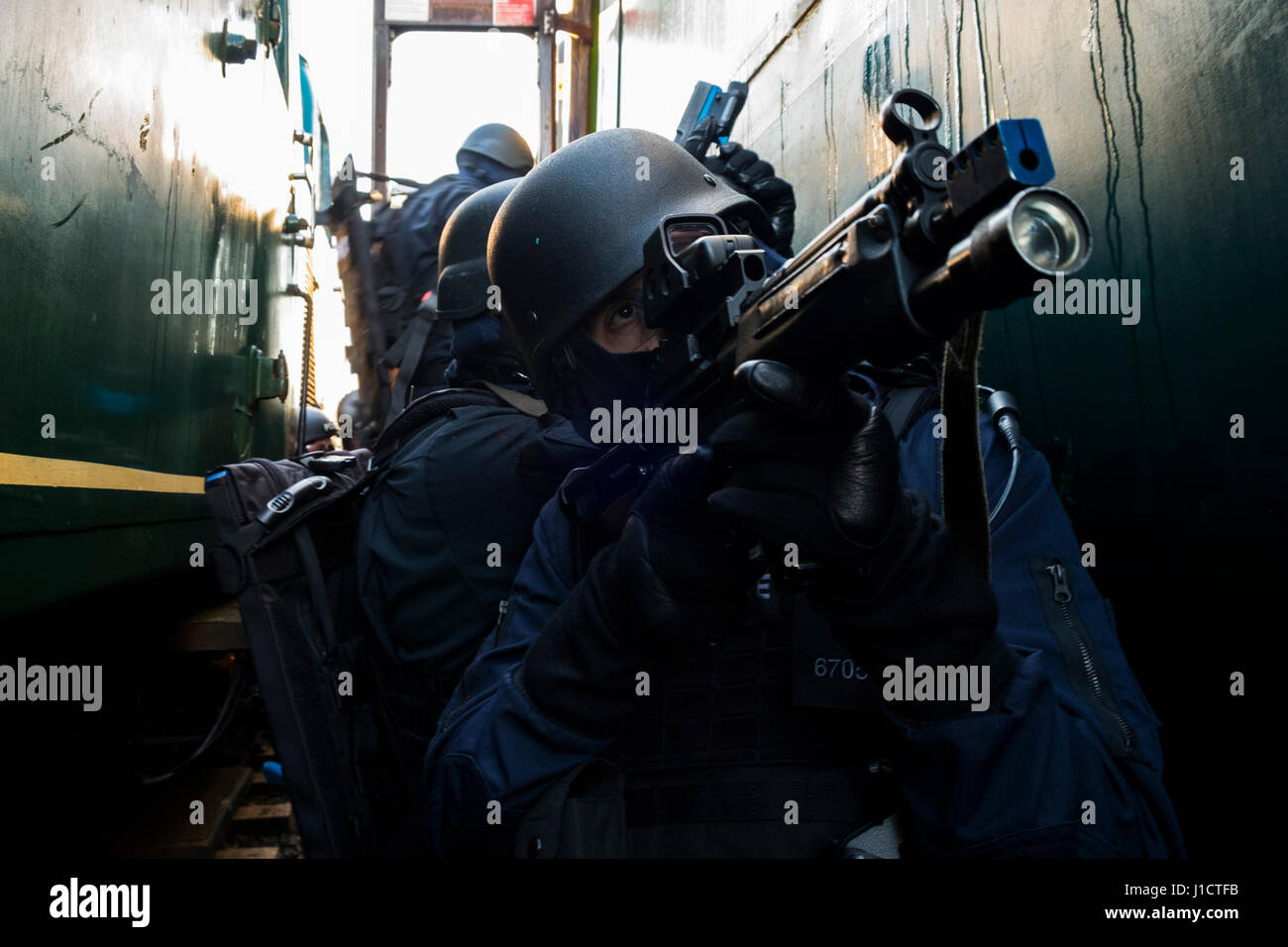 British armed police officers firearms exercise where they storm a ...