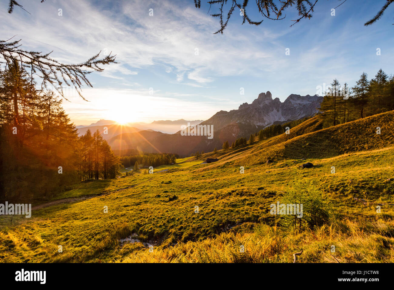 Autumn Sunset on a pasture in the Austrian Alps Stock Photo - Alamy