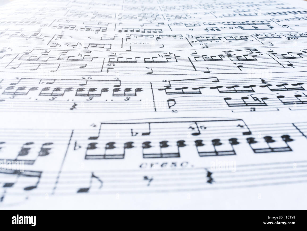 Musical note marks on a white sheet of paper. Selective focus Stock ...