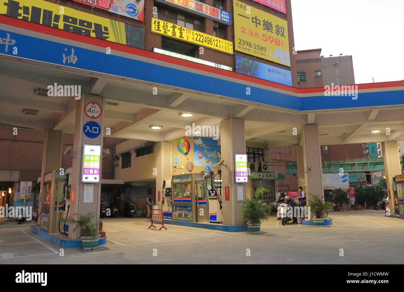 People buy petrol at CPC petrol station in Taichung Taiwan. CPC is a ...