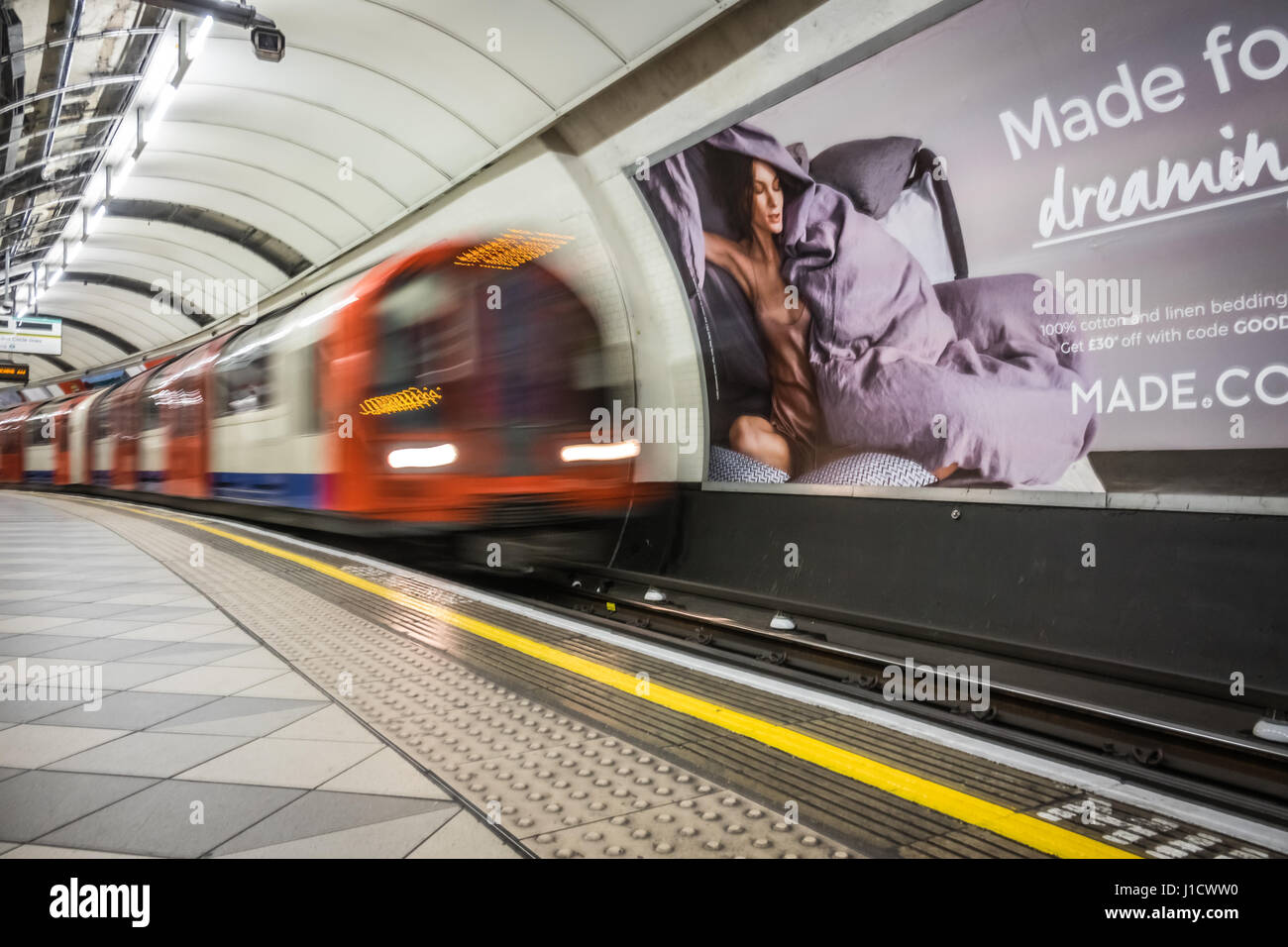 London, England - 25 March 2017 : A tube train arriving at the station ...
