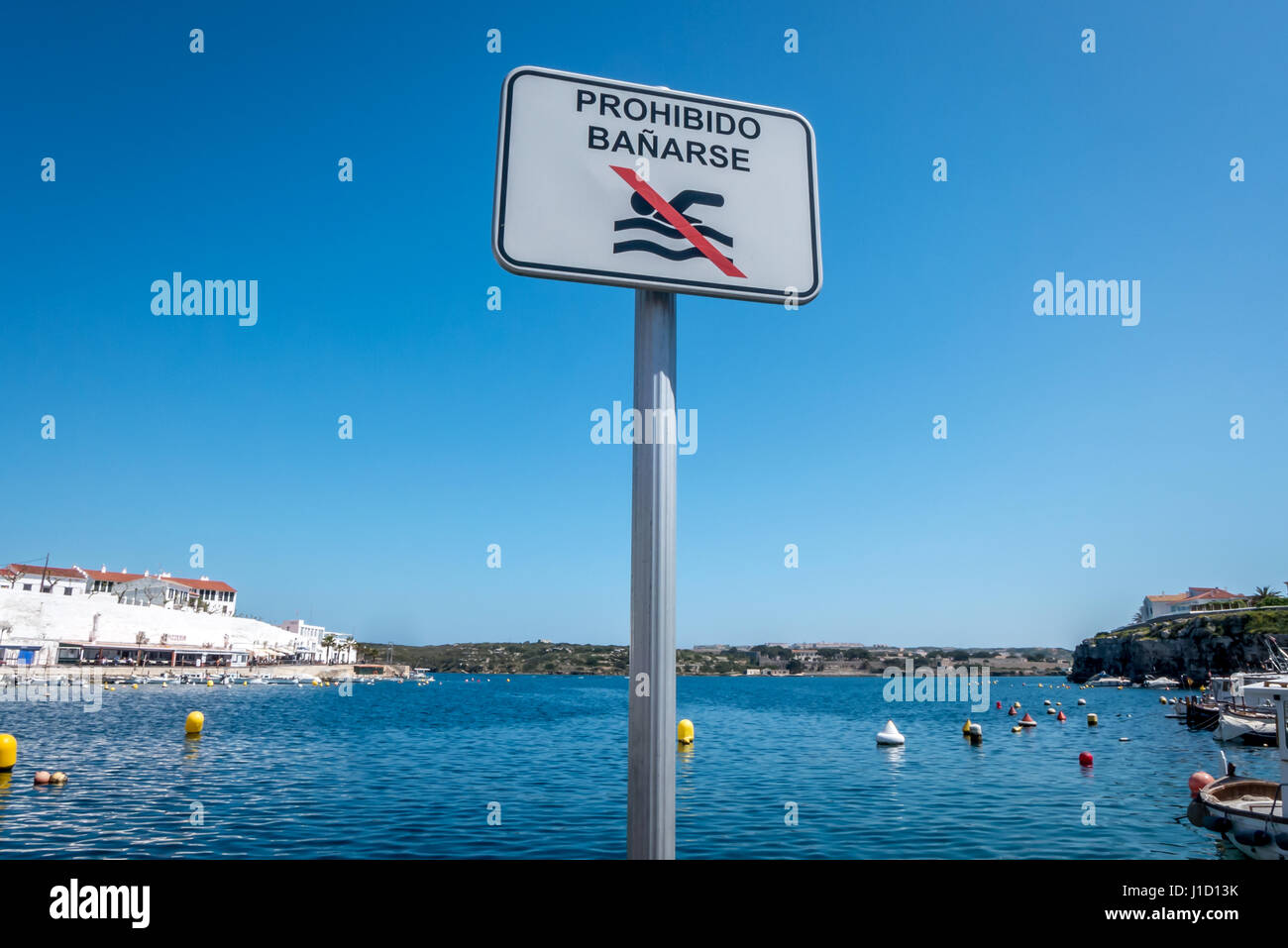 No swimming sign in the harbour of Mahon, Menorca Stock Photo - Alamy