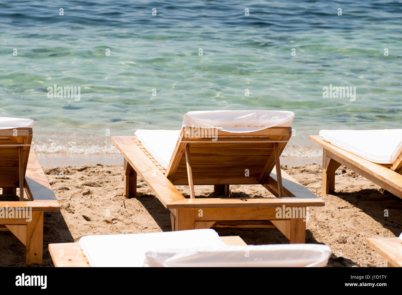 Chairs on beach near the sea Stock Photo - Alamy