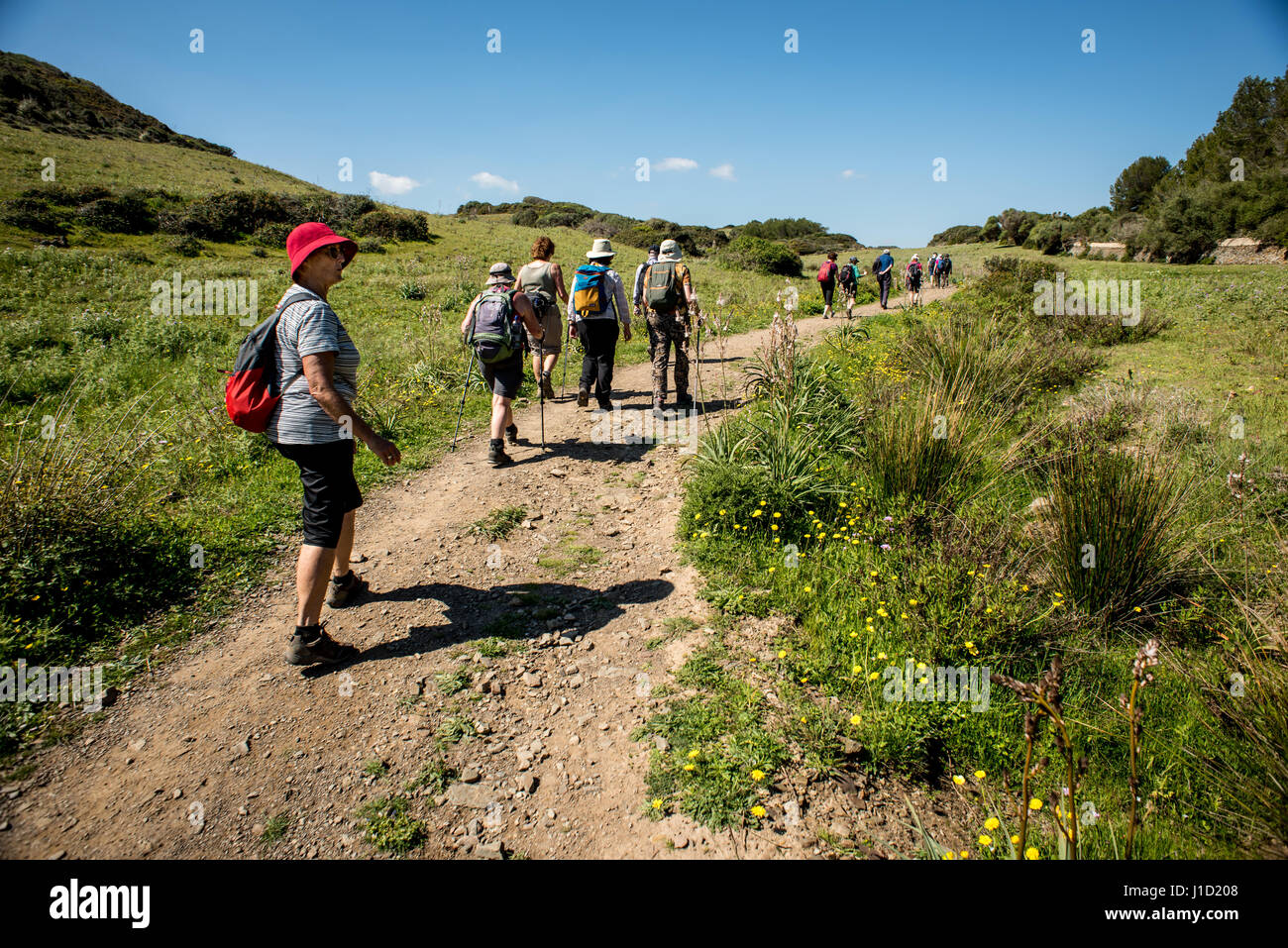 Walkers on the Cami de Cavalls coastal path in Menorca Stock Photo - Alamy