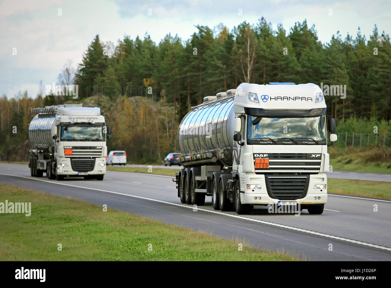 PAIMIO, FINLAND - SEPTEMBER 30, 2016: Two white DAF semi tank trucks on ...