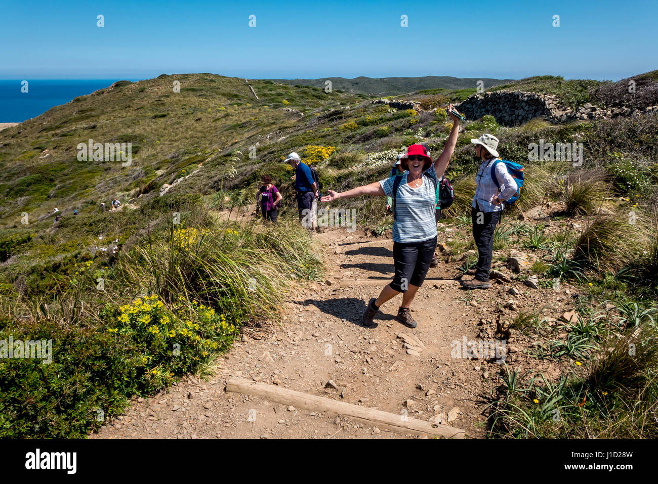 Walkers on the Cami de Cavalls coastal path in Menorca Stock Photo - Alamy
