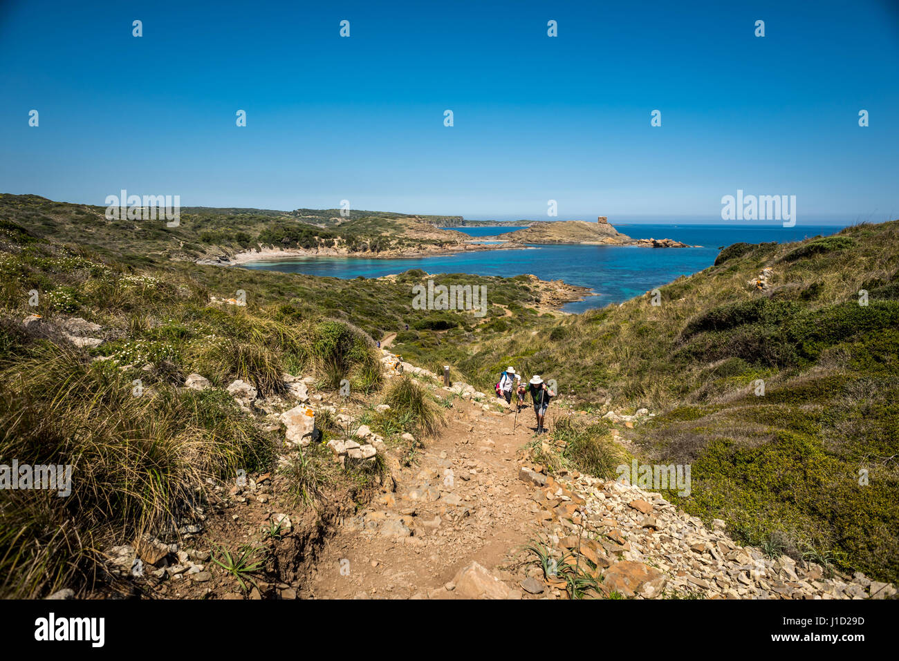 Walkers on the Cami de Cavalls coastal path in Menorca Stock Photo - Alamy