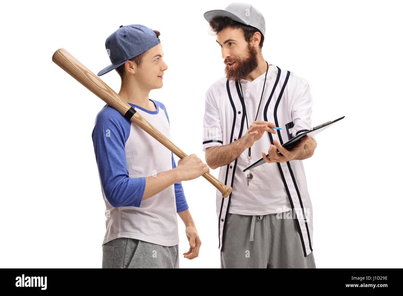 Baseball coach advising a teenage baseball player isolated on white ...