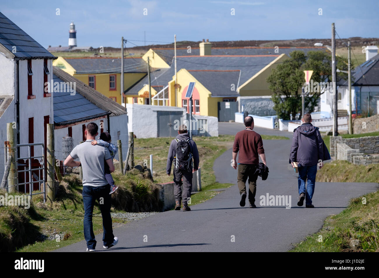 Walking through West Town on Tory Island, County Donegal Stock Photo ...