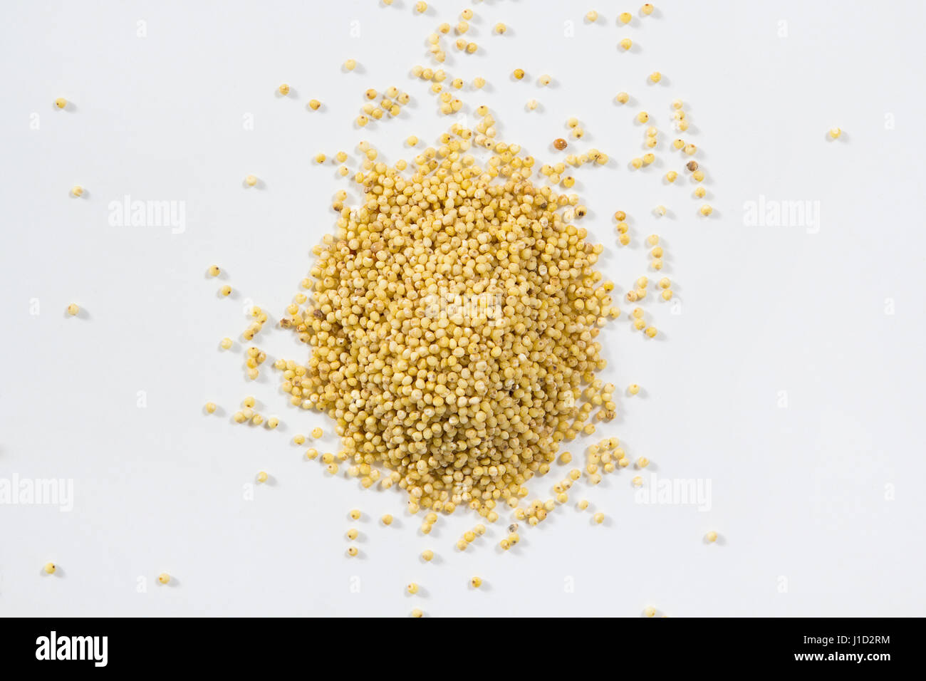 Yellow millet groats background, raw millet isolated Stock Photo - Alamy