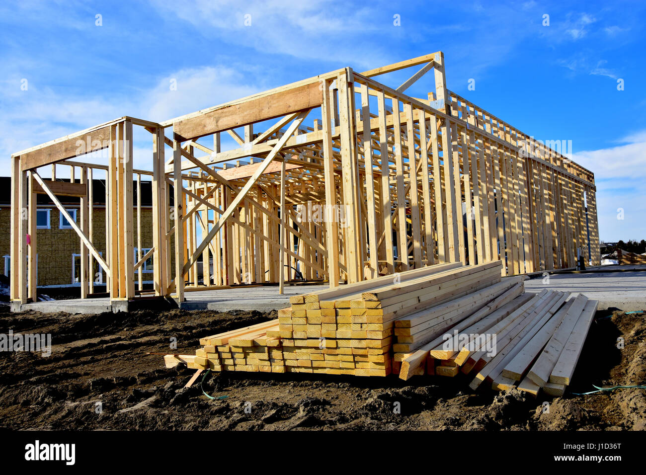 Wood frame homes under construction Stock Photo - Alamy