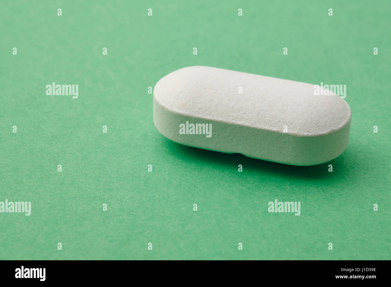 Pill over a green background. Medicament treatment. Health care photo ...