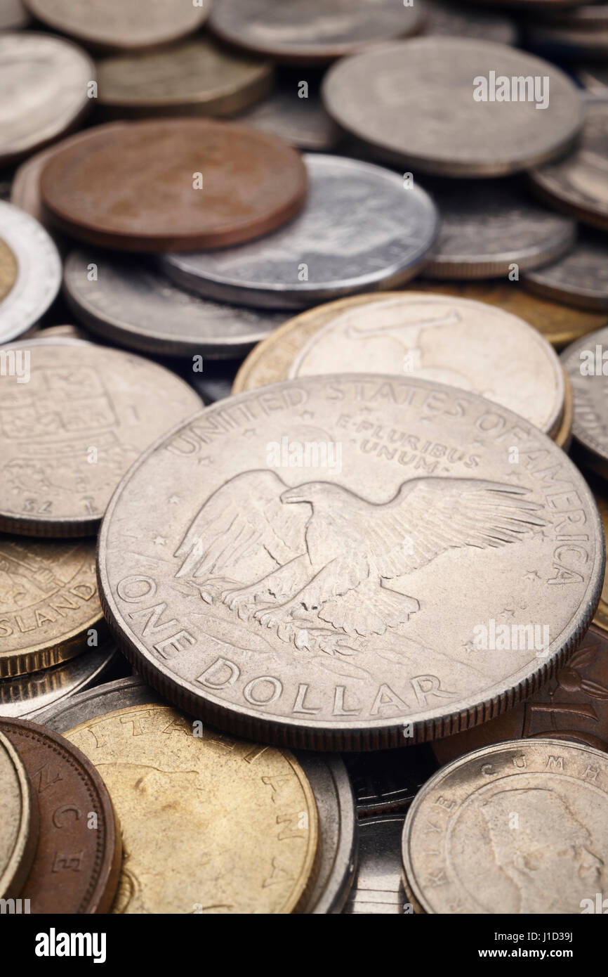 Different kinds on coins over a white background. Macro detail ...