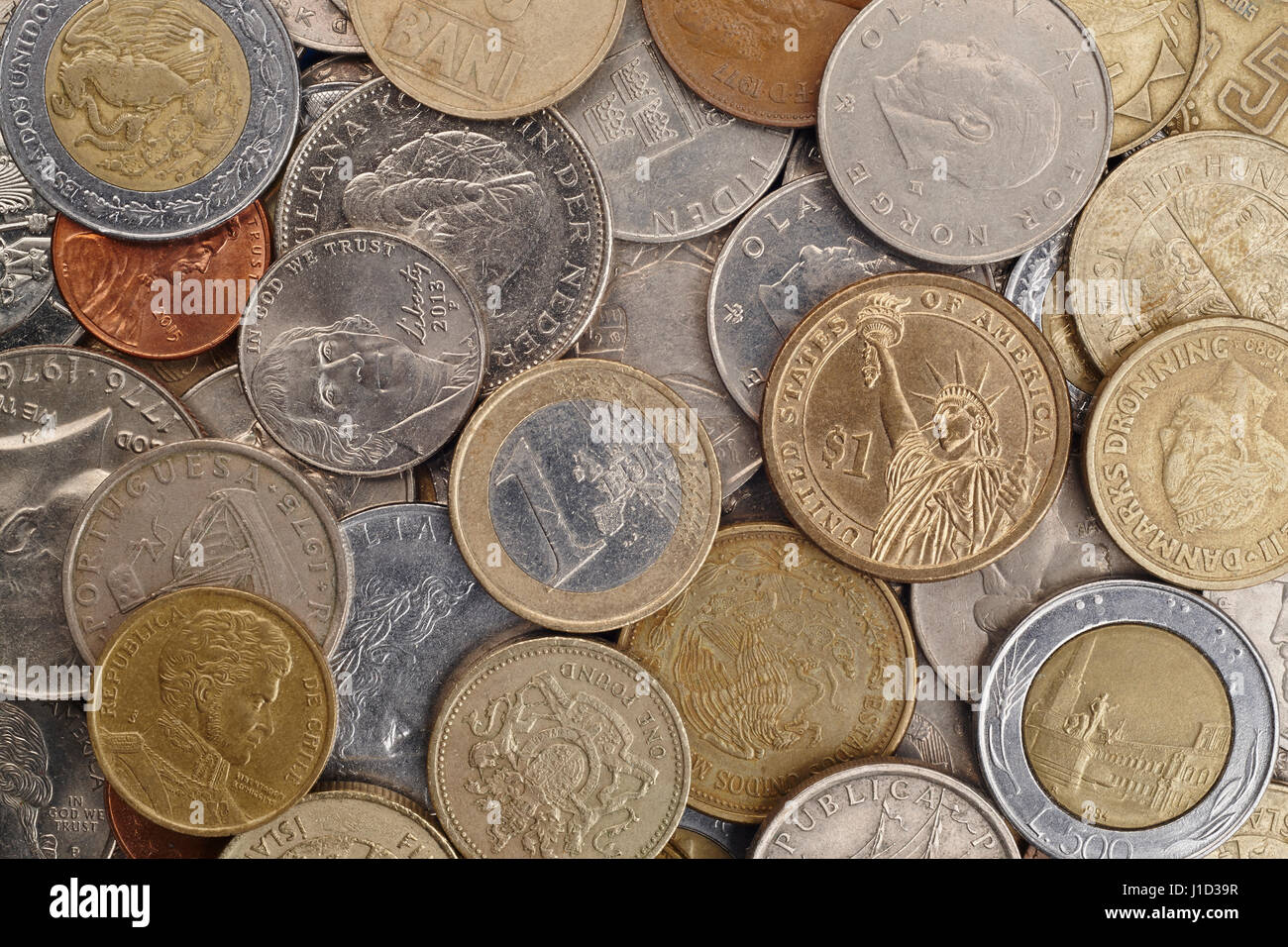 Different kinds on coins over a white background. Macro detail ...