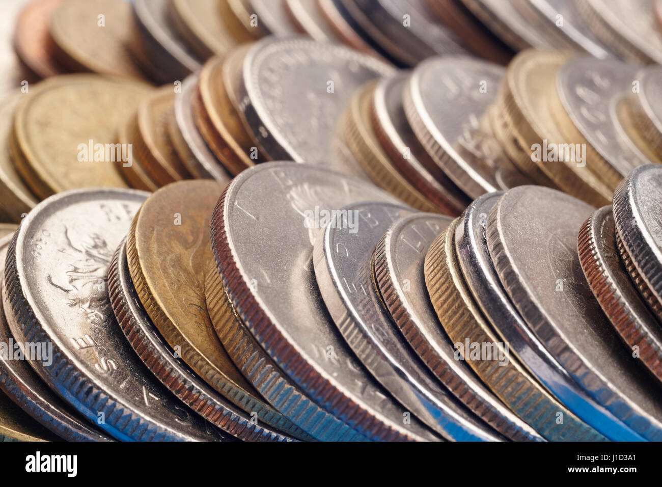 Different kinds of coins stacked. Macro detail. Horizontal Stock Photo ...