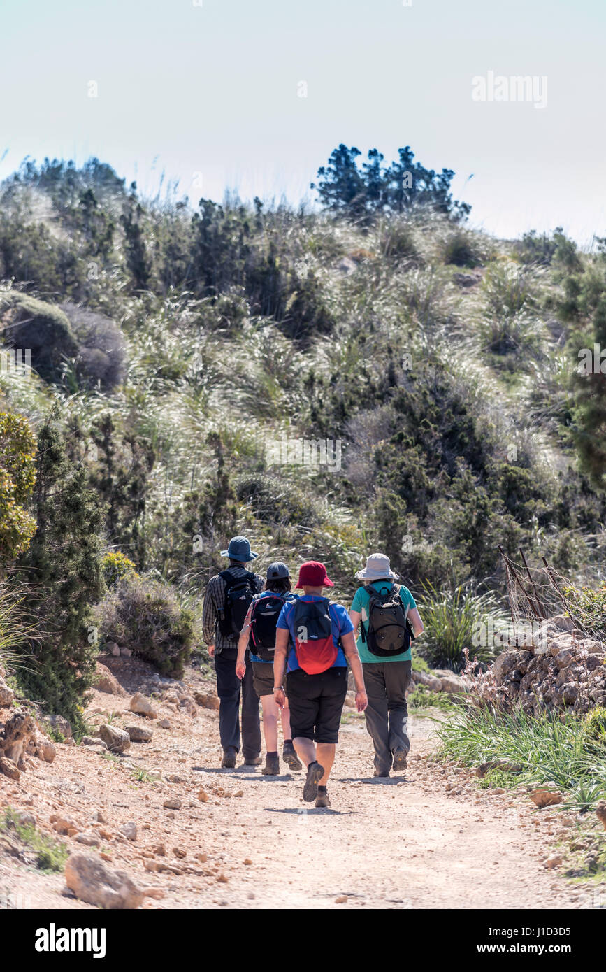 Walkers on the coastal path of Menorca Stock Photo - Alamy
