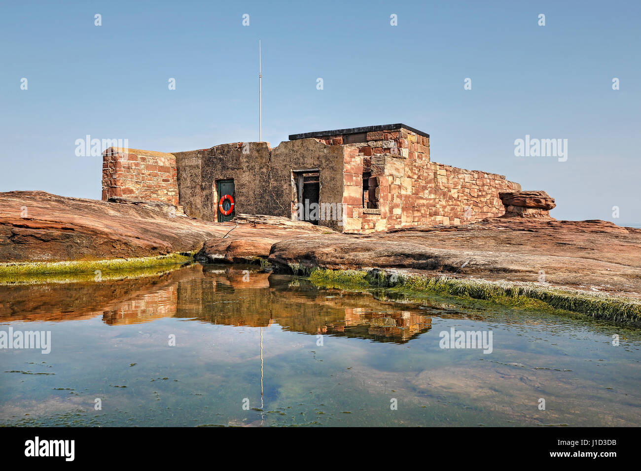 Hilbre Island view of north end showing old lifeboat station and bird ...
