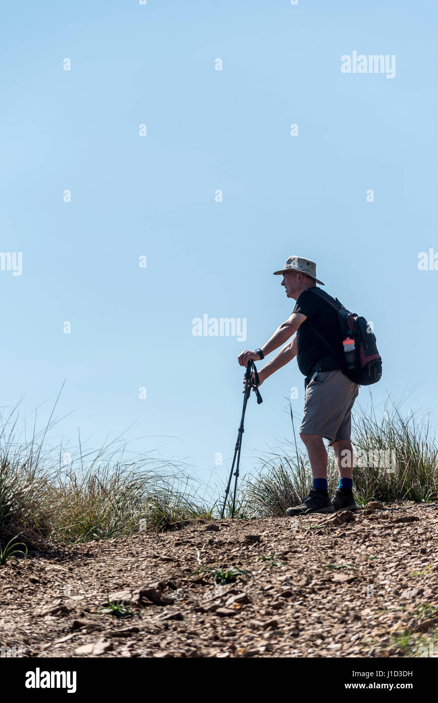 A hiker taking a rest on the coastal path on Menorca Stock Photo - Alamy