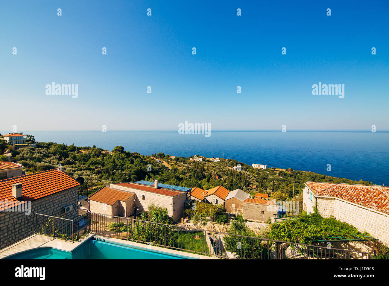 The sea view from the window. Montenegro Coast. The roofs of the Stock ...