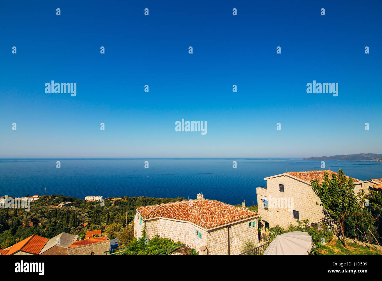 The sea view from the window. Montenegro Coast. The roofs of the Stock ...