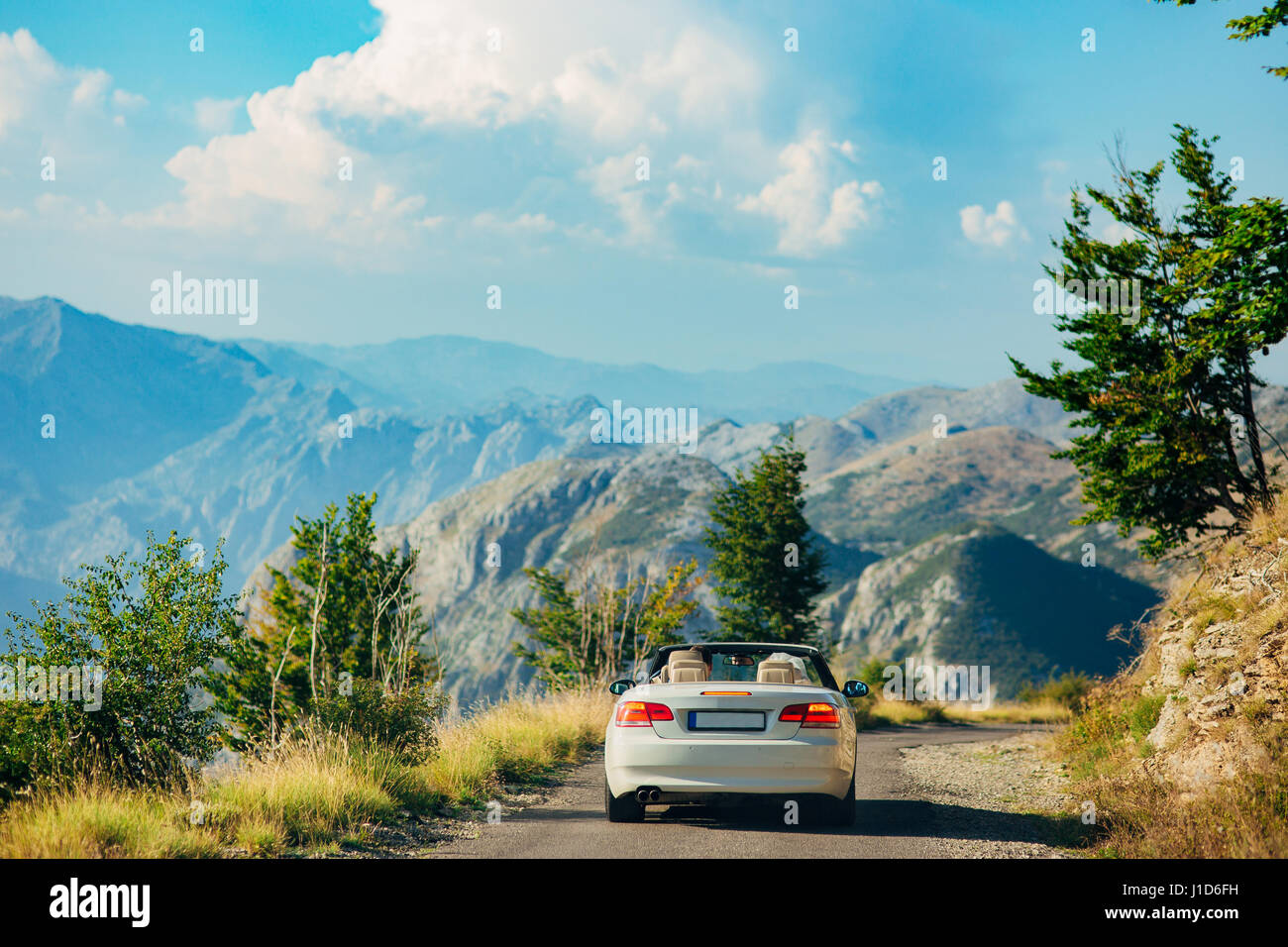 The car rides on mountain roads Stock Photo - Alamy