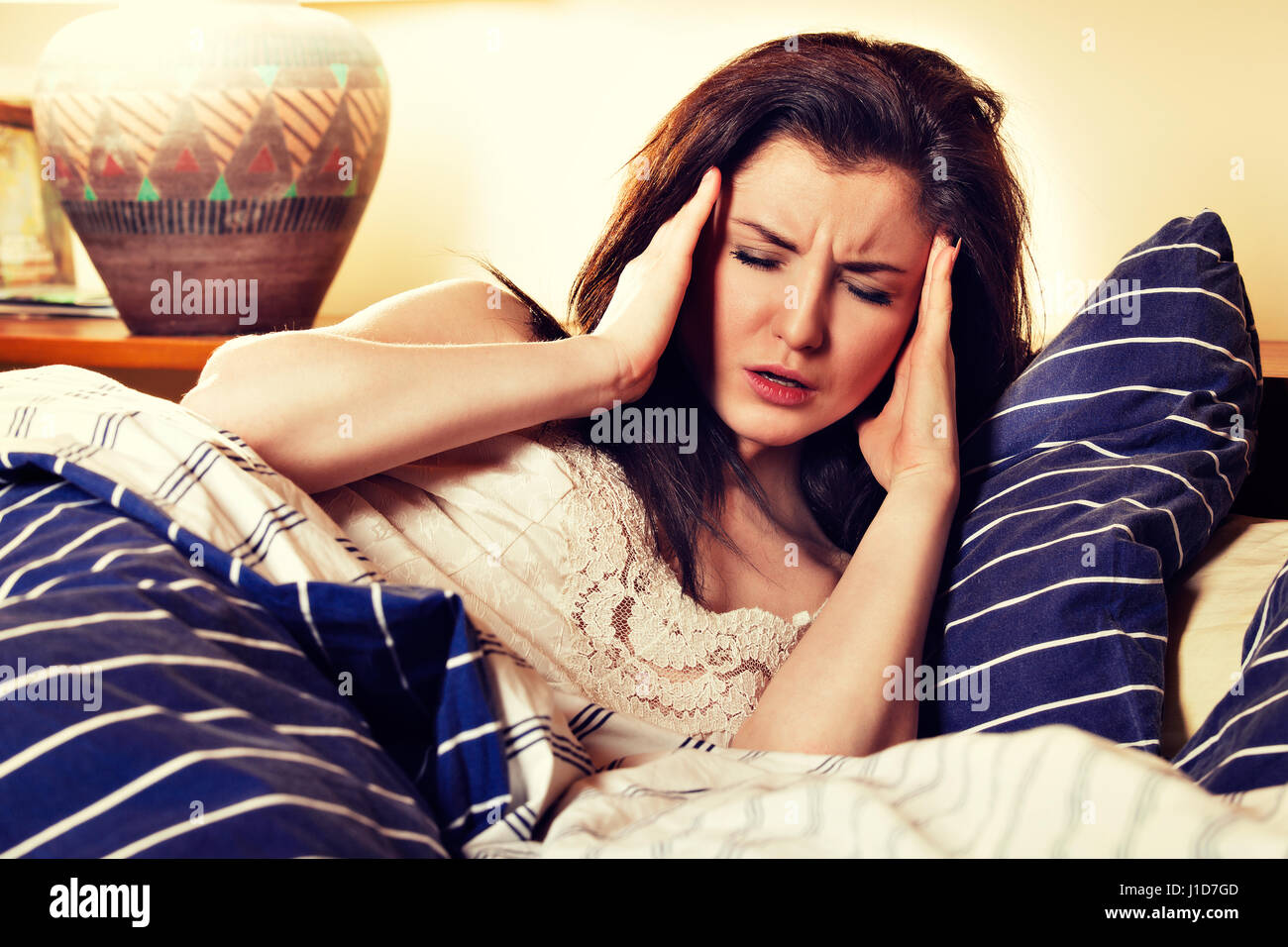 Pretty brunette woman in bed hi-res stock photography and images - Alamy