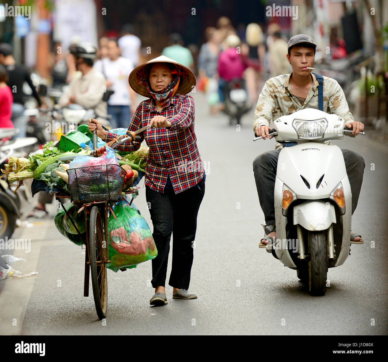 Street traders and hawkers selling hats, fruit, vegetables, cleaning ...