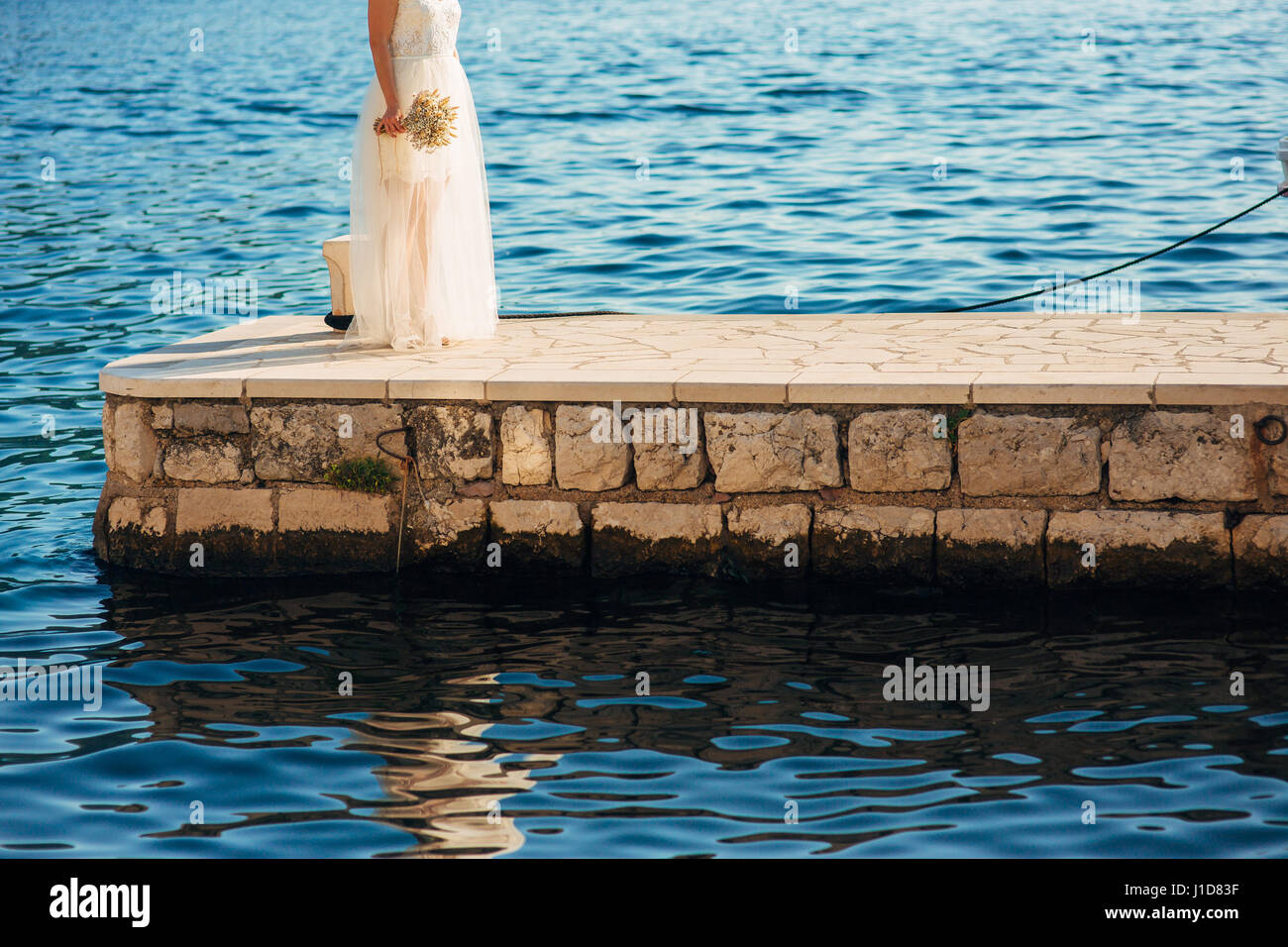 Female and male feet on the dock Stock Photo - Alamy
