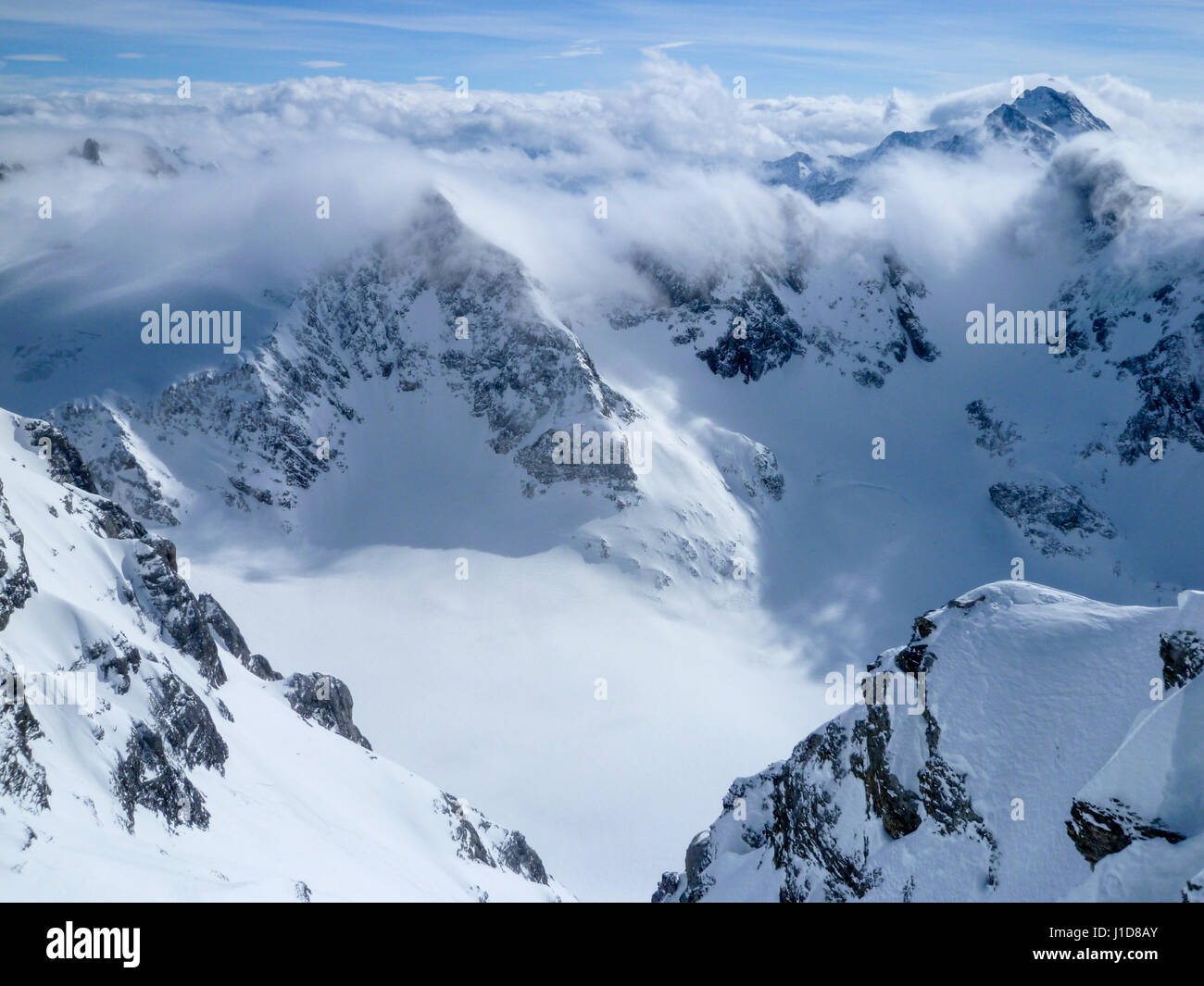Winter landscape from mount Titlis over Engelberg to the swiss alps ...