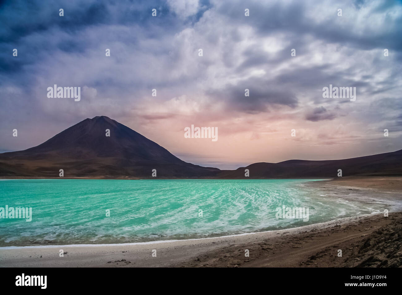 Green lagoon called Laguna Verde in Altiplano mountains, southern ...