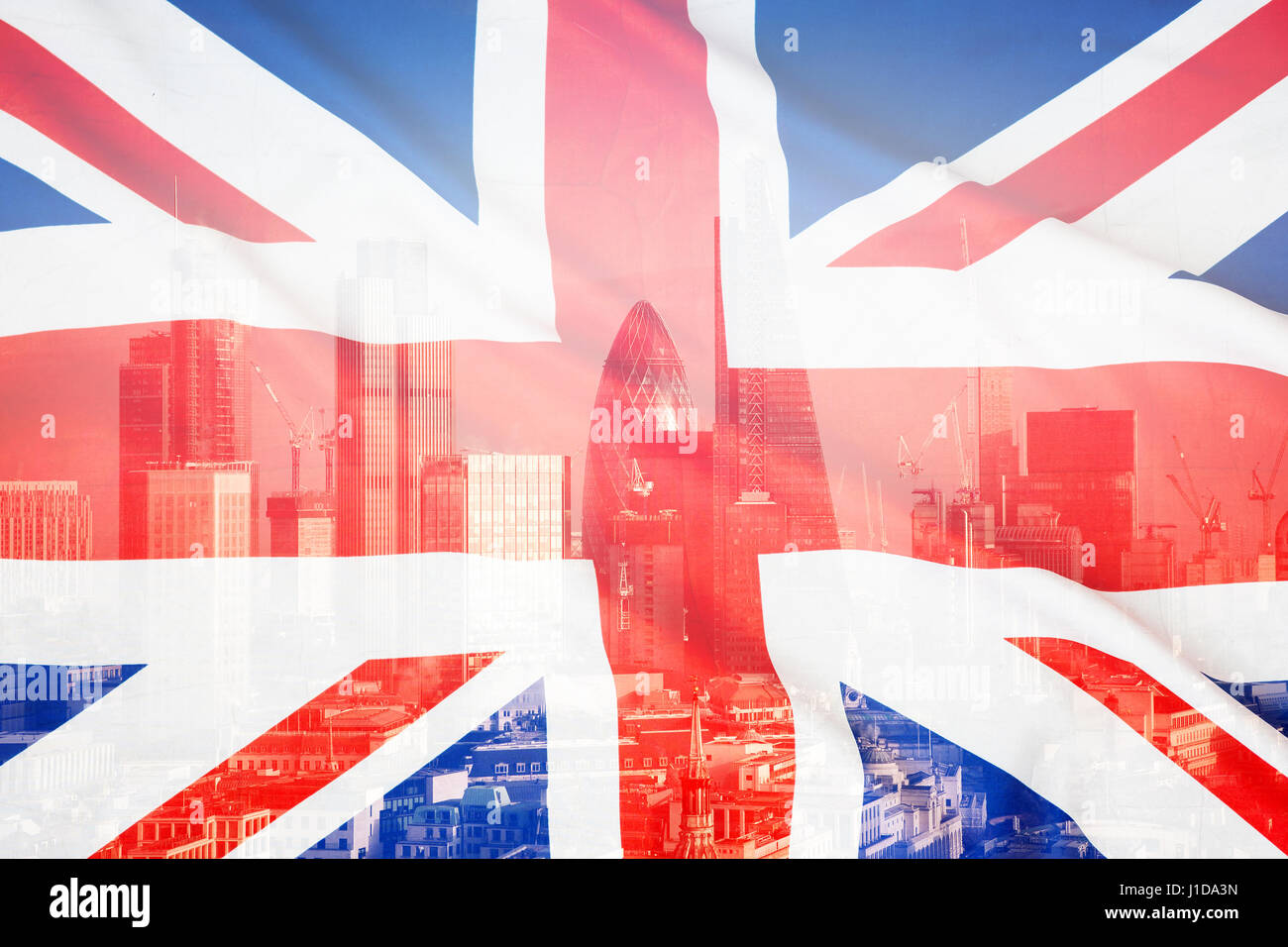 union jack flag over London financial district with iconic skyscrapers ...