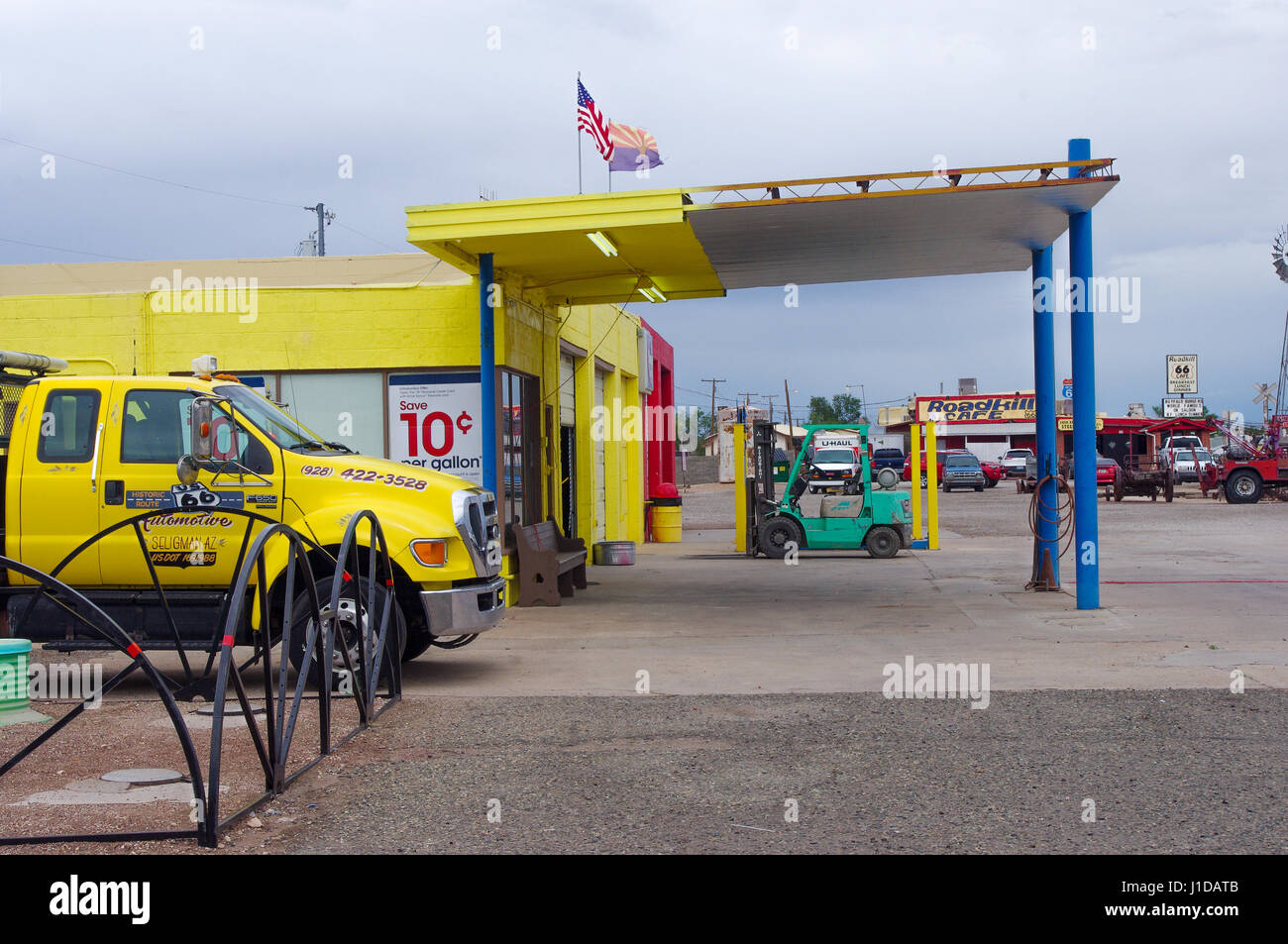 Yellow gas station with two truck in rural Arizona, usa, on one of the ...