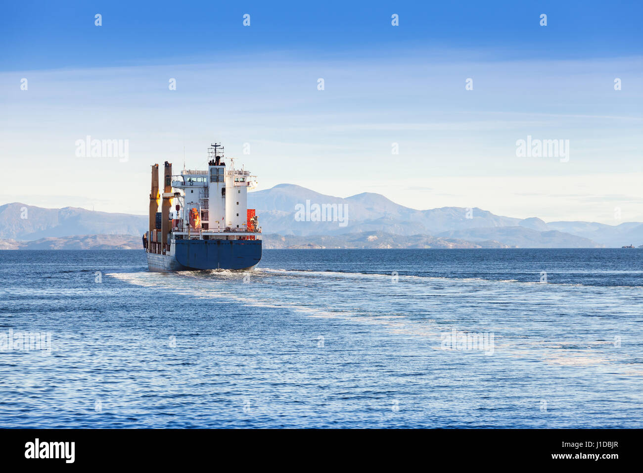 Container ship goes on Norwegian sea, rear view, Trondheim region Stock ...