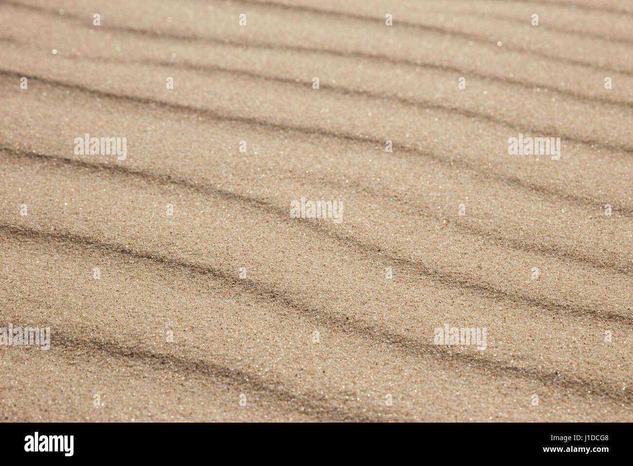 Beach sand waves Stock Photo - Alamy