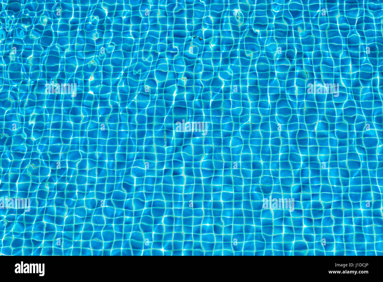 Abstract background of sparkling cool blue water in a swimming pool ...