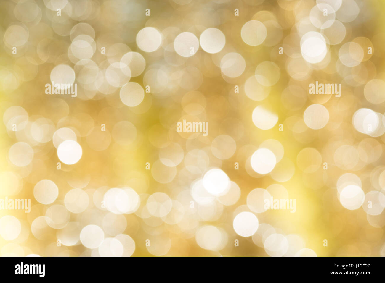 Gold blurred abstract bokeh light backgound form streamer in christmas ...