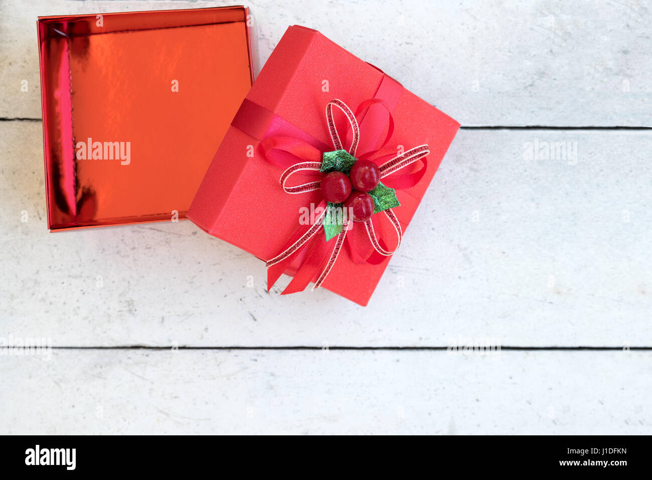 Open christmas gift box on wood table background with copy space Stock ...