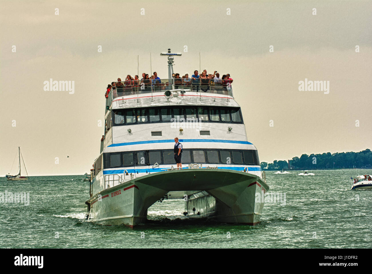 ferry jet boat full of people Stock Photo - Alamy