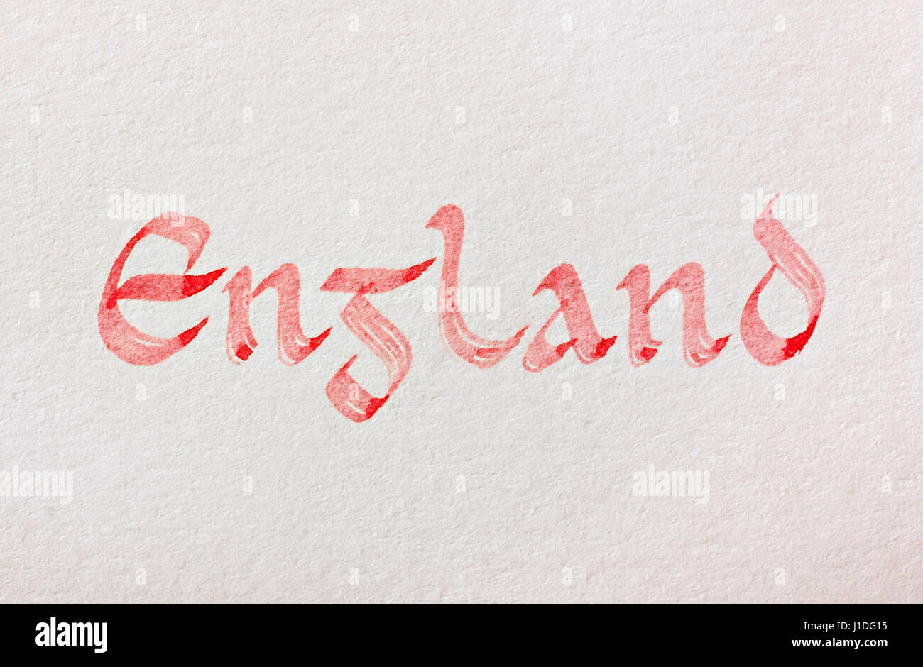 Handwritten country name over white paper background. England. Latin ...