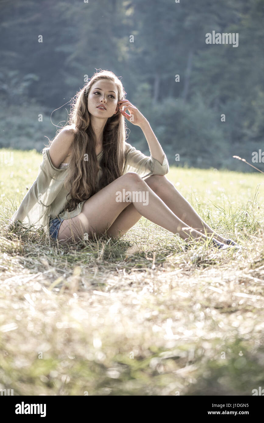 Young singer song-writer musician guitar girl in autumn forest, Vienna ...