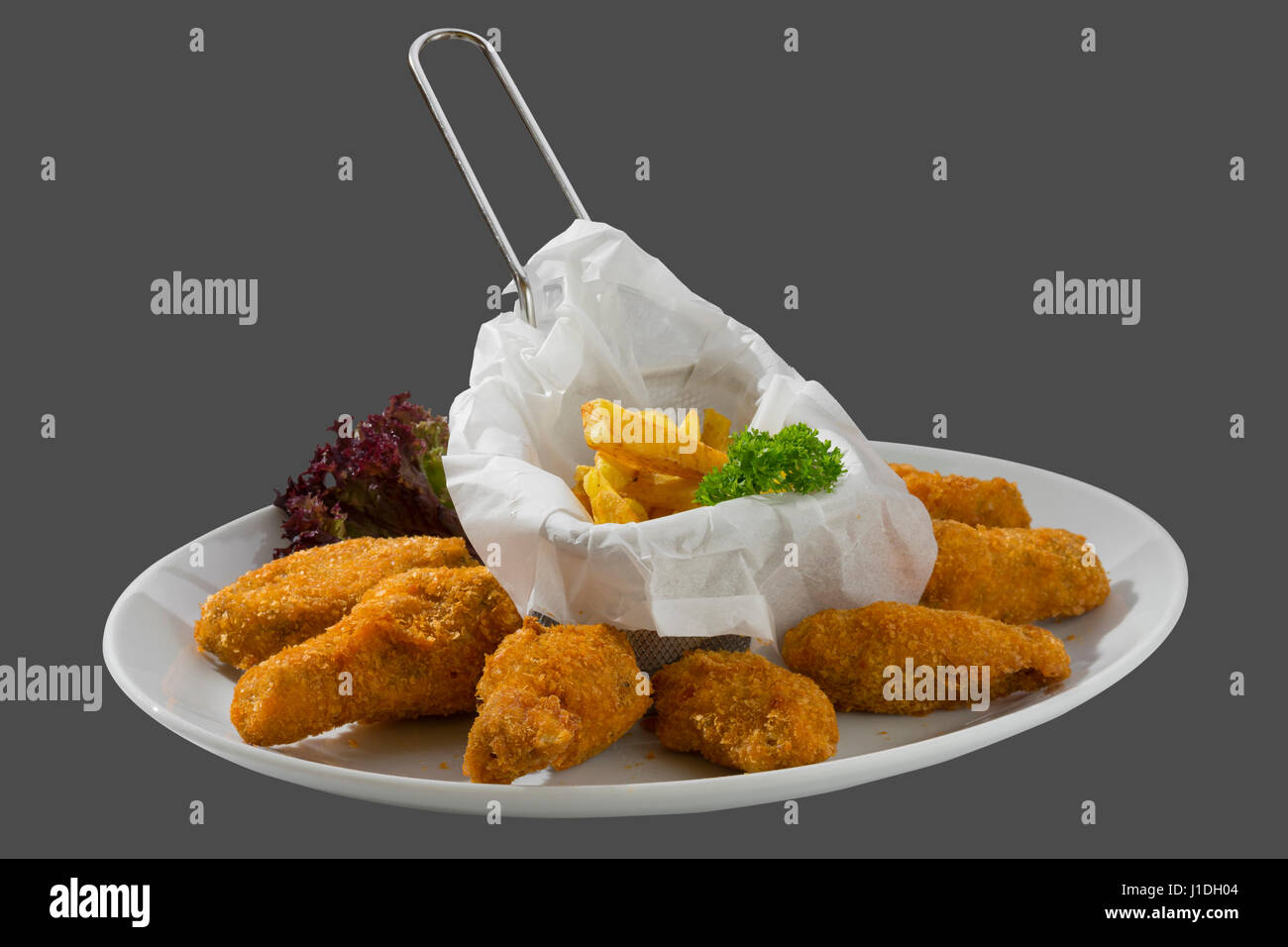 A portion of chicken cooked with French fries Stock Photo - Alamy